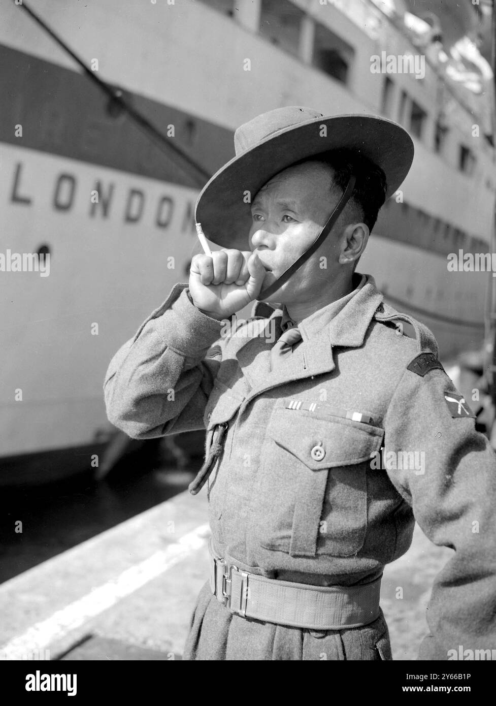 London: smoking a cigarette in the typical Indian manner is Corporal ...