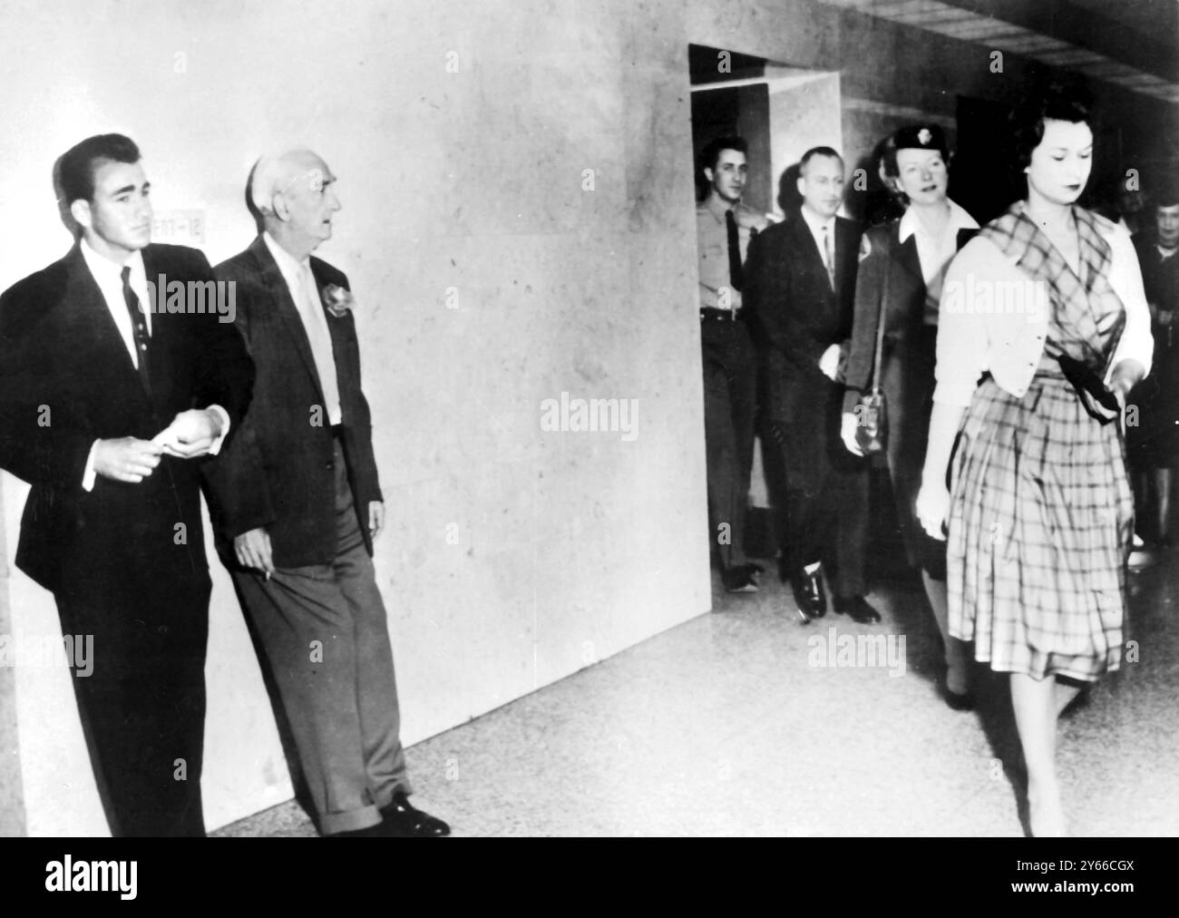 Carole Tregoff followed by a woman deputy and Dr Bernard Finch as they ...