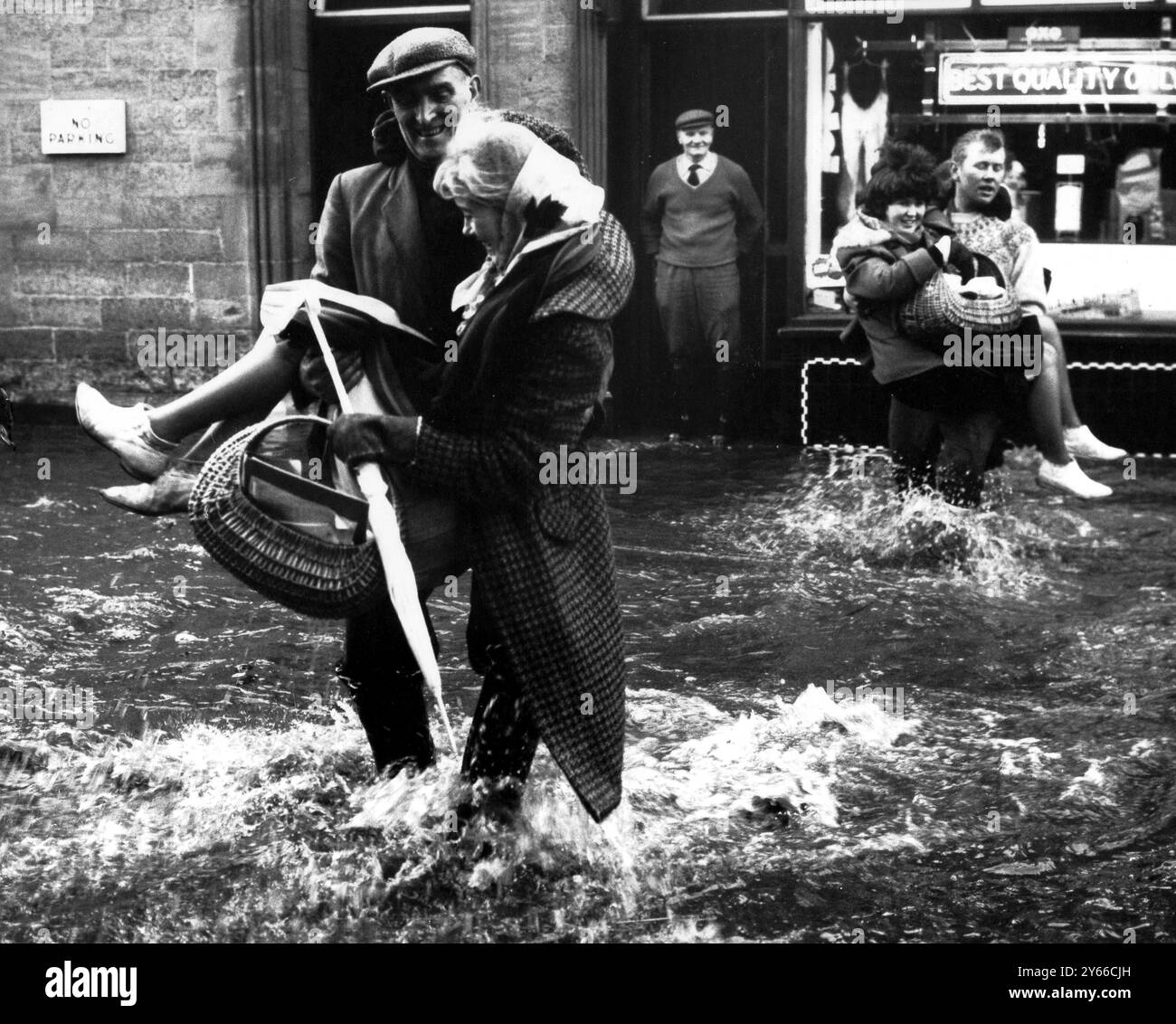 Helping hands in the Northern Floods office girls were carried through ...