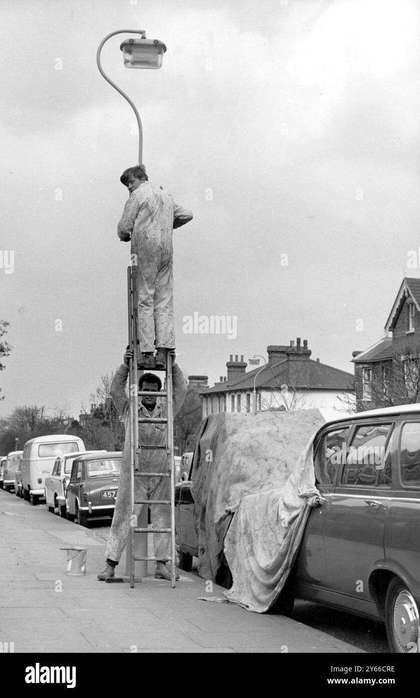 Courtesy Covers For Kerbside Cars. Workmen in a Sidcup Street in Kent ...