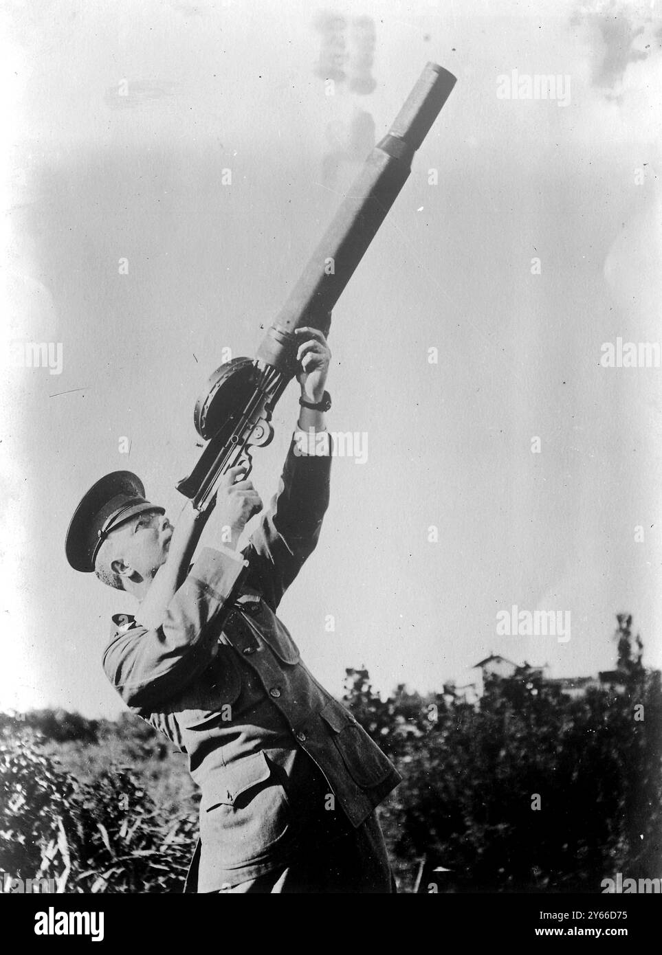 Lewis Aeroplane Gun. Capt. Chandler showing how the gun is operated ...