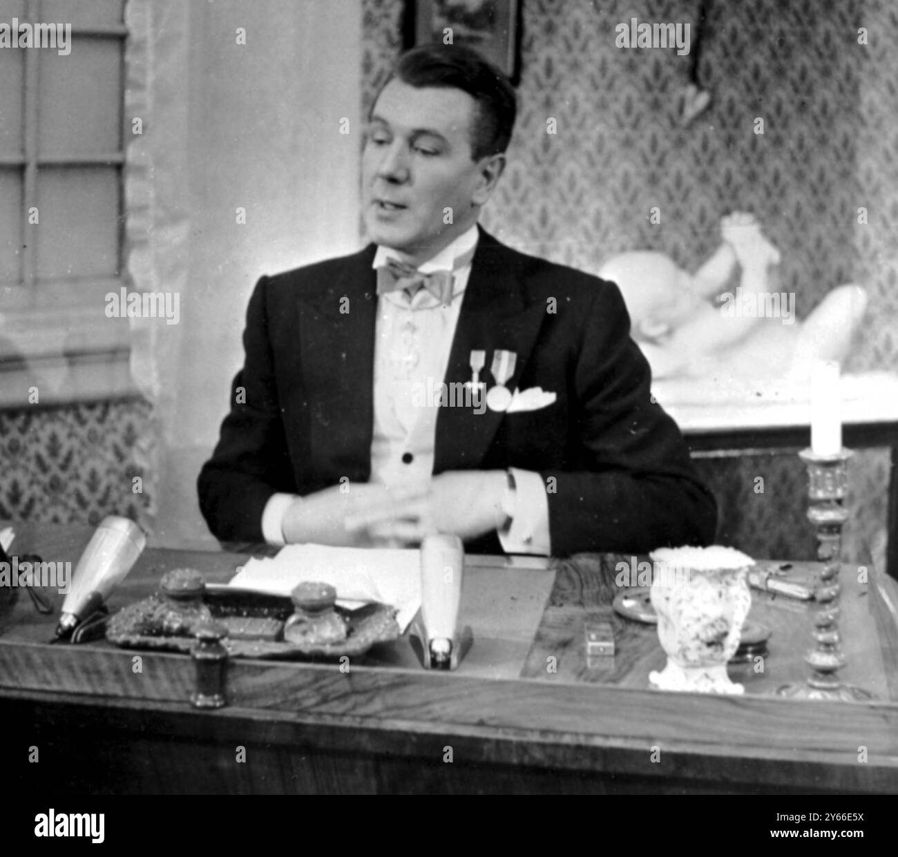 British film and stage actor Michael Redgrave reading one of Hans ...