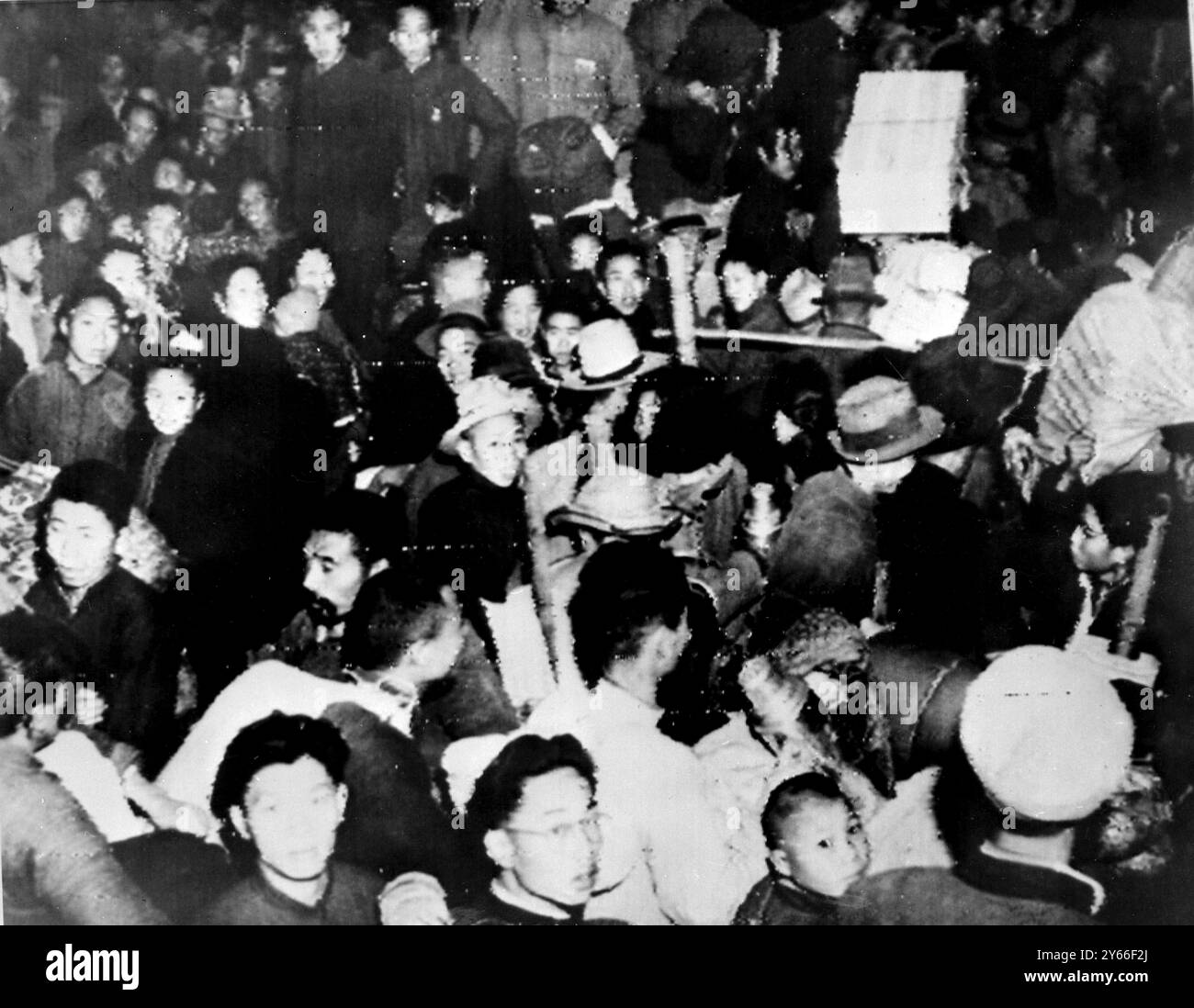 A scene of panic as Nanking China residents swarm to the railroad ...