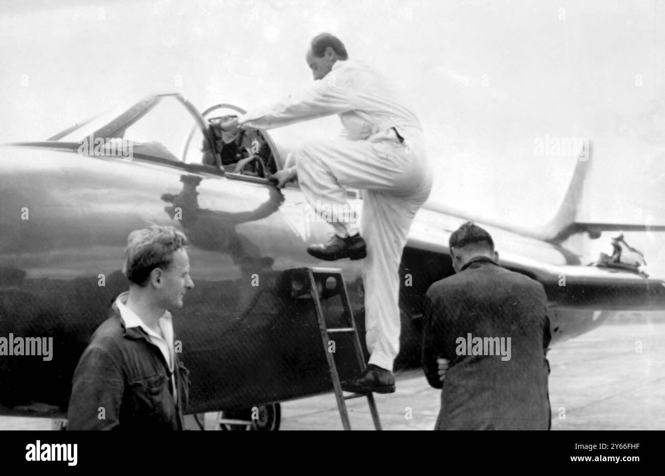 Neville Duke test pilot & squadron leader climbs into a Hawker Hunter ...