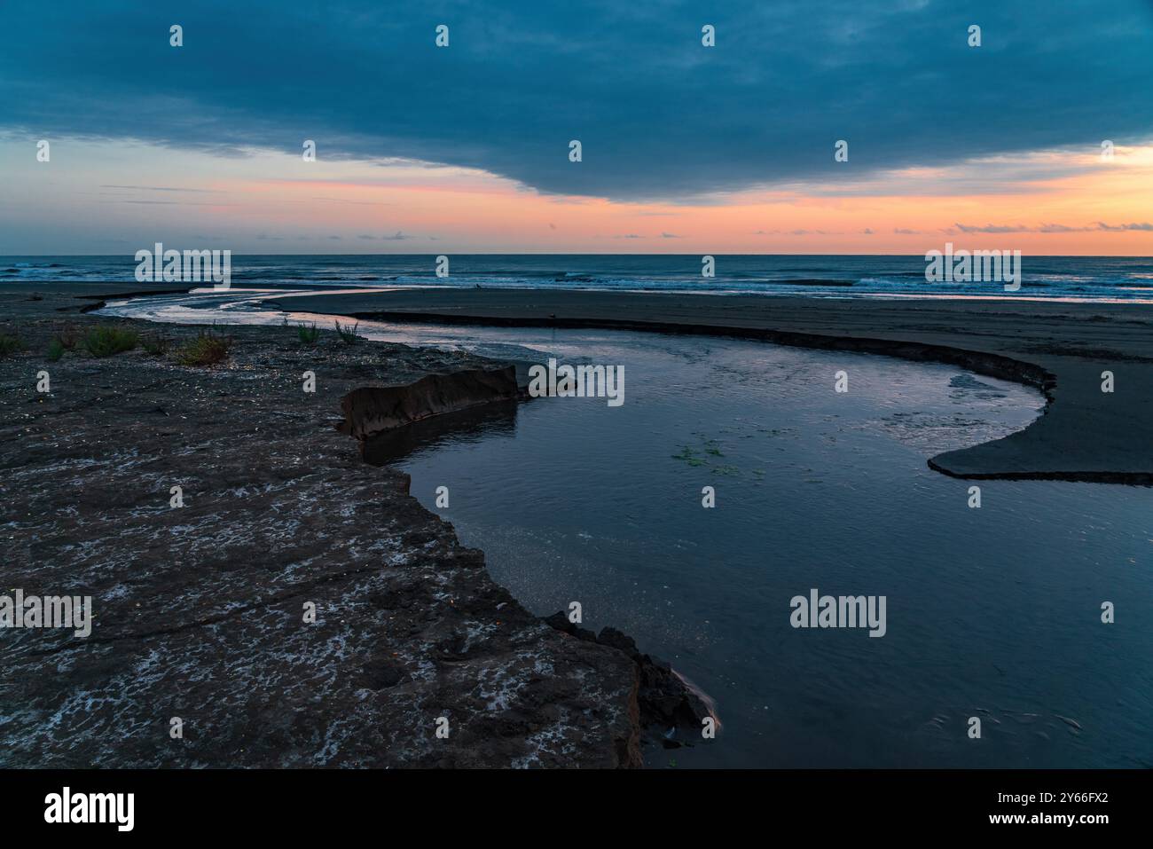 The mouth of a small river flowing into the sea Stock Photo - Alamy