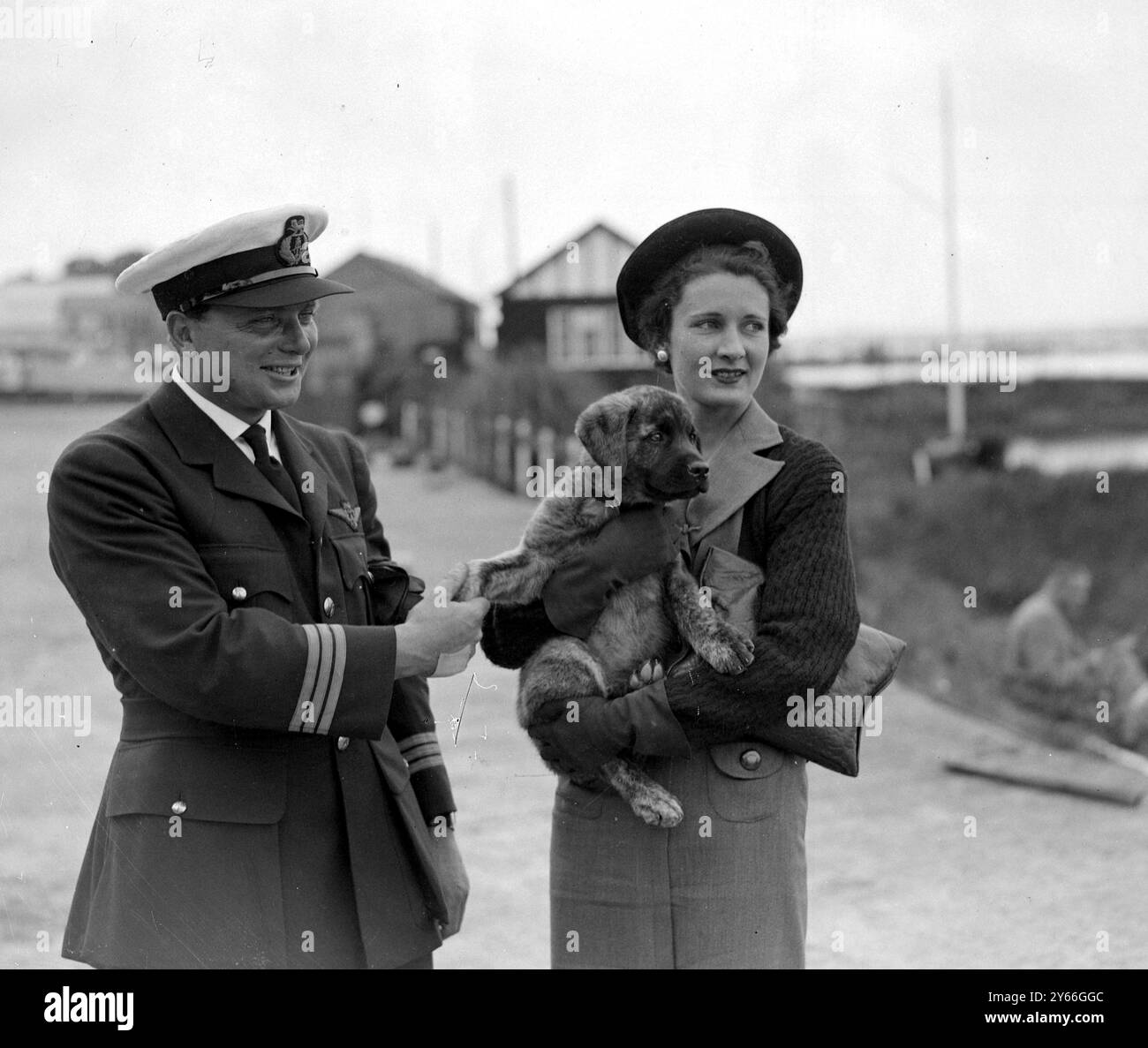 Captain Powell saying goodbye to his wife and Buster the dog for next ...