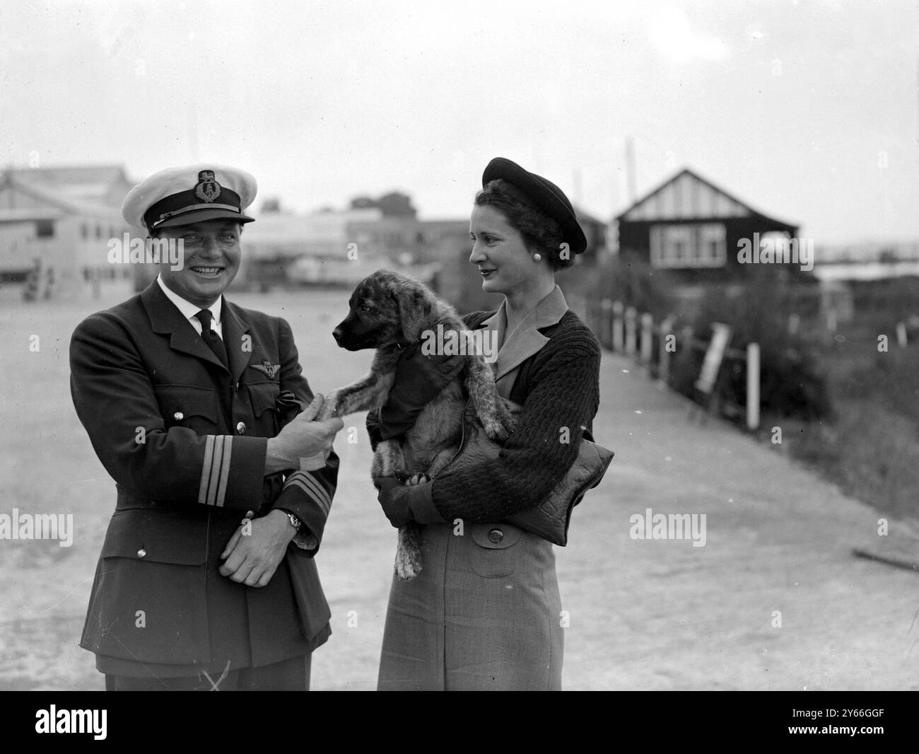 Captain Powell saying goodbye to his wife and Buster the dog for next ...