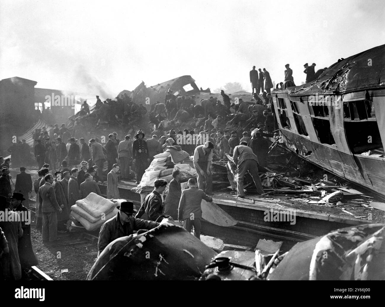 Rescue workers searching the wreckage for survivors of the three train ...