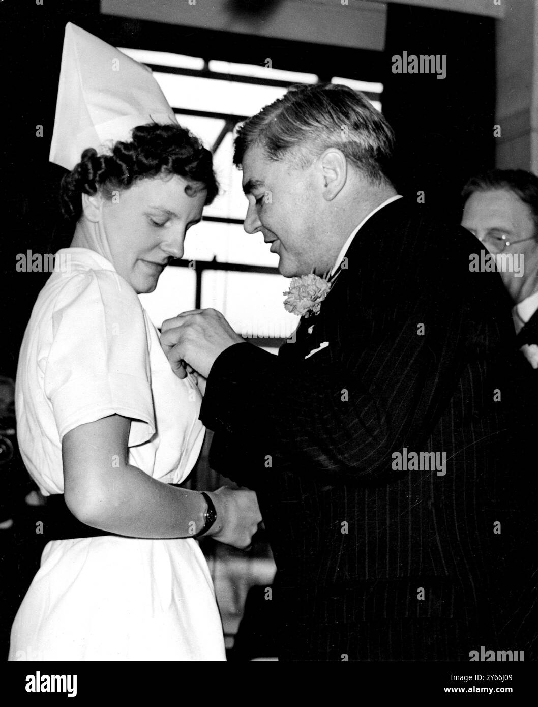 Mr Aneurin Bevan, Minister of Health, presenting Daphne Margaret ...