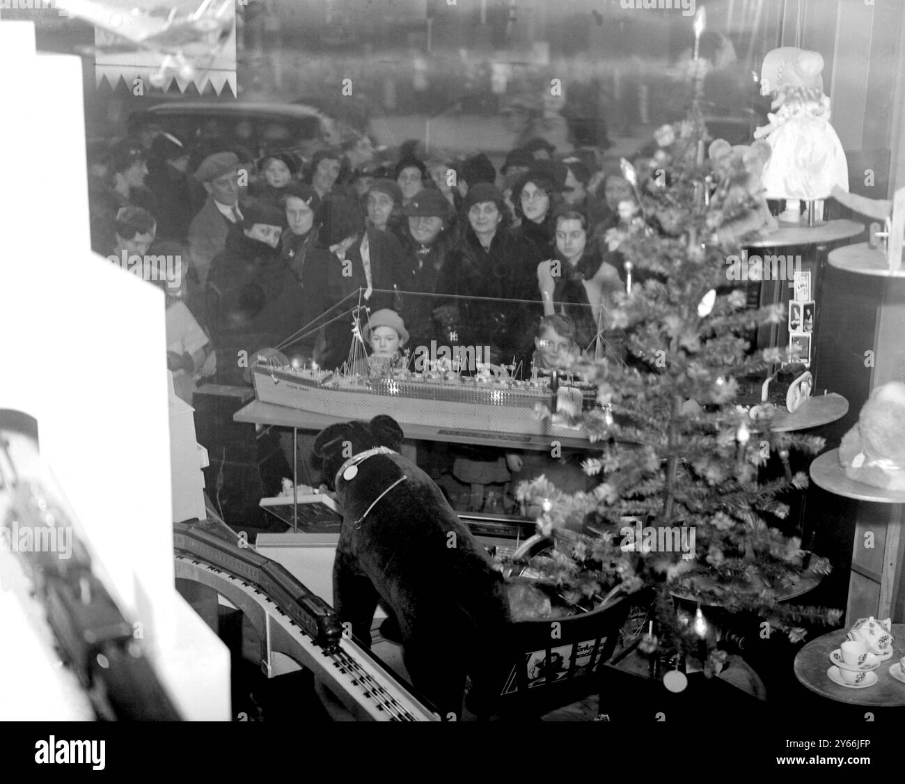 Admiring the toy display at Selfridges 3rd December 1935 Stock Photo ...