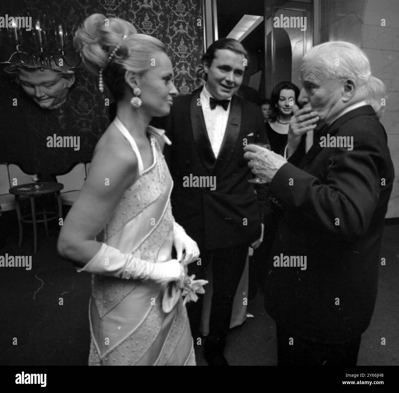 Veteran comedian Charles Chaplin wears a pained expression while ...