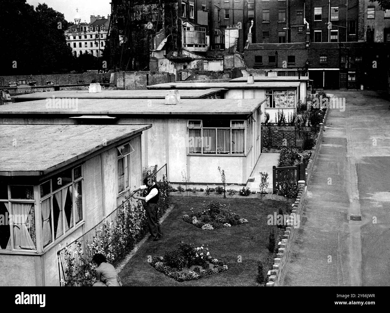 A number of prefabricated houses have been erected at the top of ...