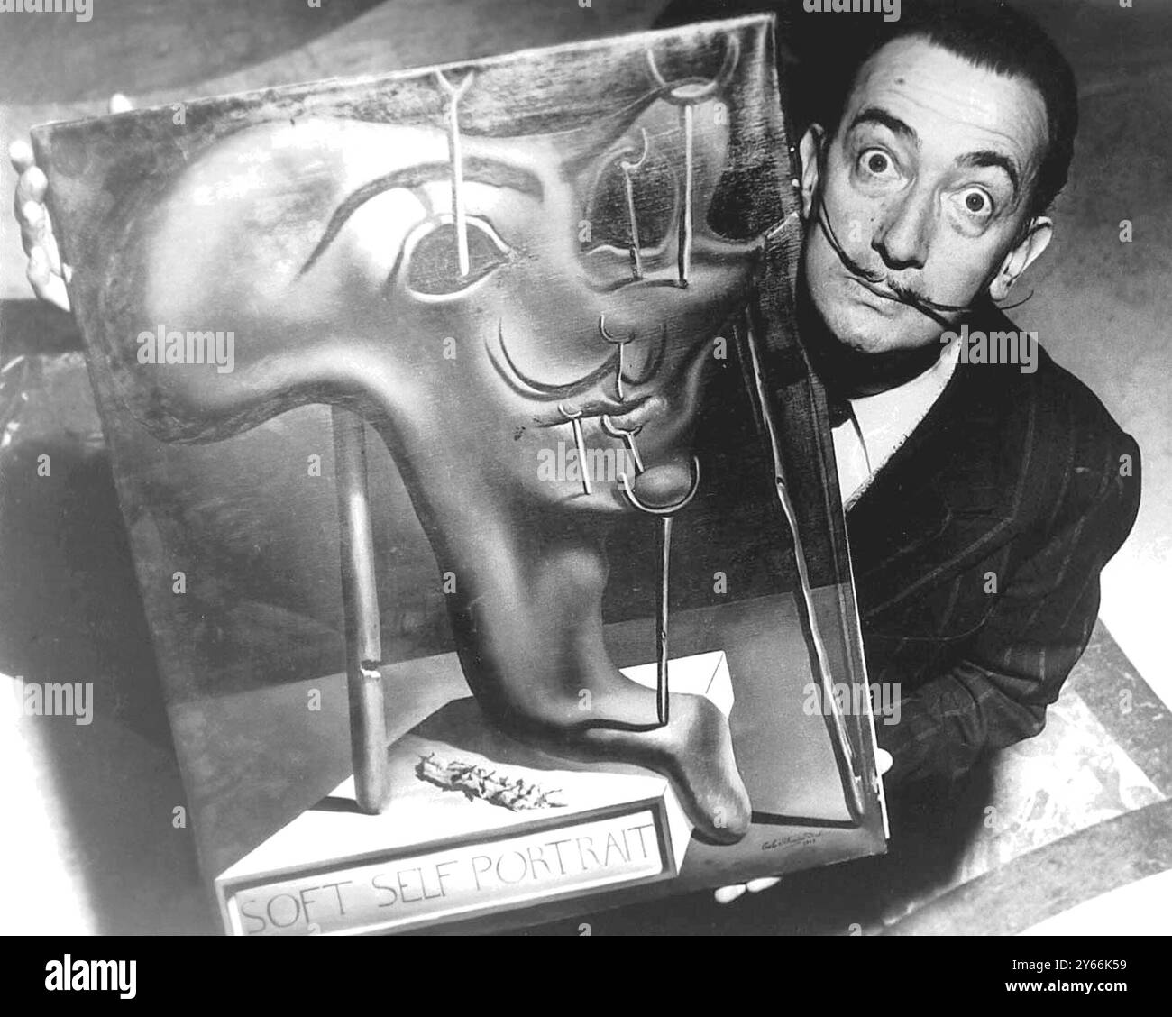 Salvador Dali with one of his works - A Soft Self Portrait 1954 Stock ...