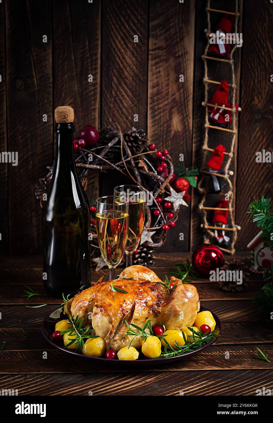 Baked chicken or baked turkey. The Christmas table is served with a ...