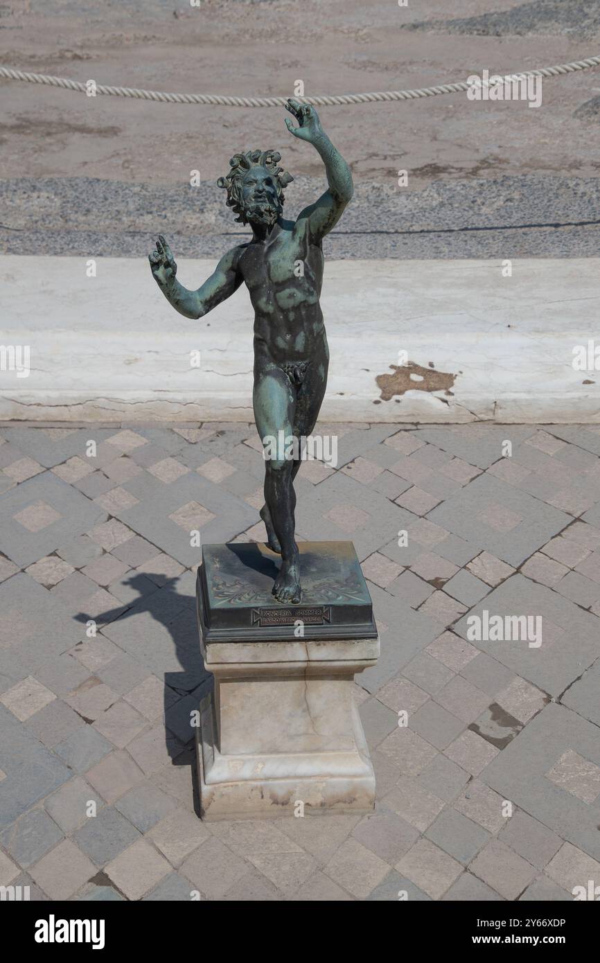 The bronze statue of the Dancing Faun or Satyr. Pompeii Stock Photo - Alamy