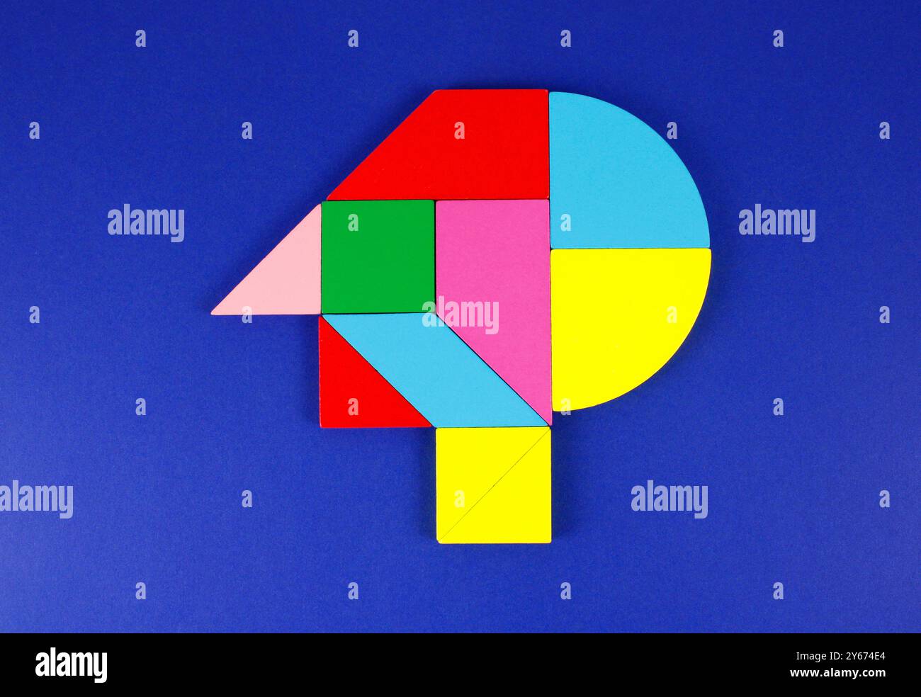 Colorful wooden figures forming a face profile Stock Photo - Alamy