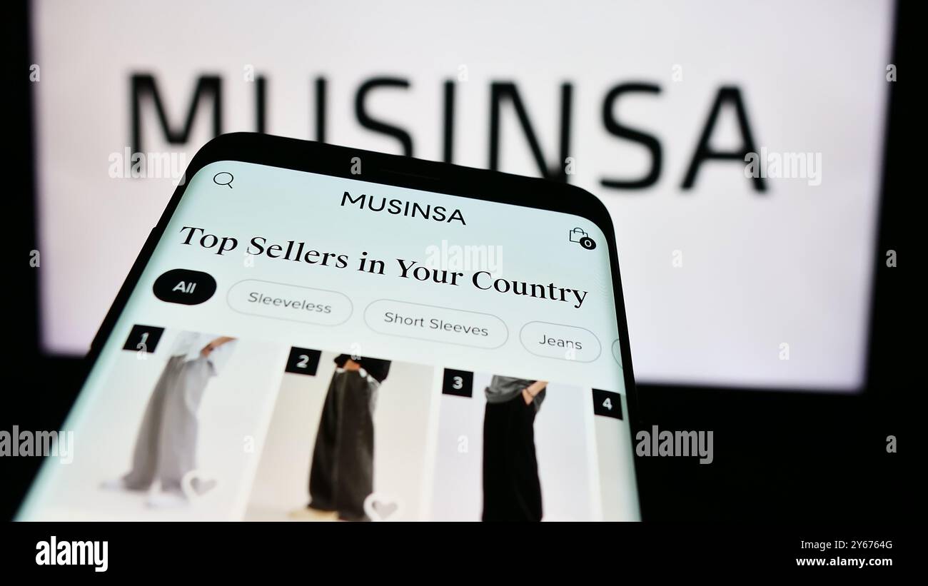 In this photo illustration, a mobile phone with the website of South Korean fashion company ...