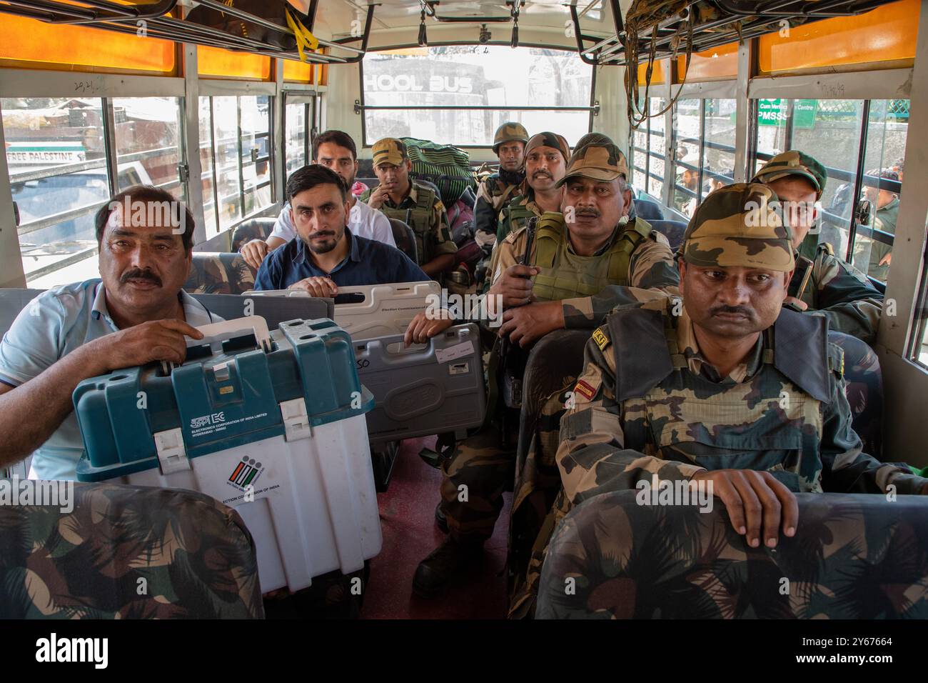 Kashmiri polling officials carrying Electronic Voting Machines (EVM ...