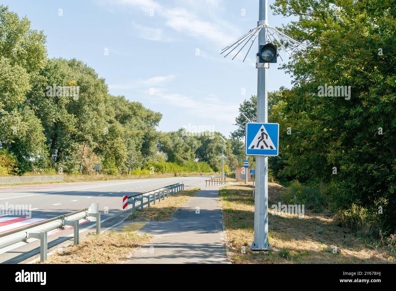 A yellow traffic light is flashing against a clear sky. Countdown timer ...
