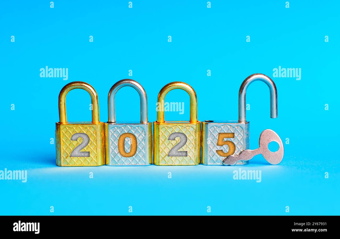 Colorful padlocks with the year 2025 and a key beside them against a ...