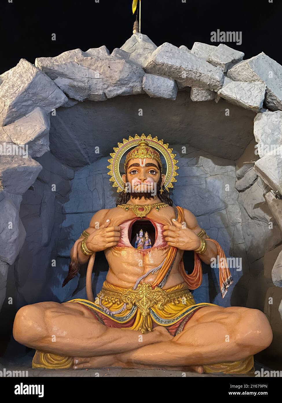 A detailed statue of Hanuman showcasing his devotion to Lord Rama and ...