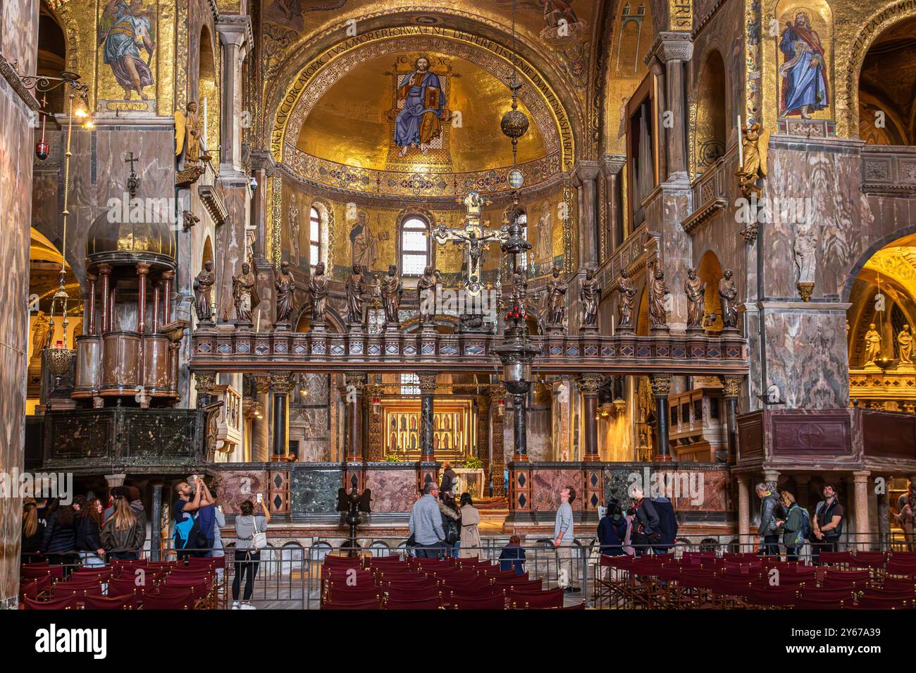People walking in front of The High Altar inside St Mark's Basilica ...