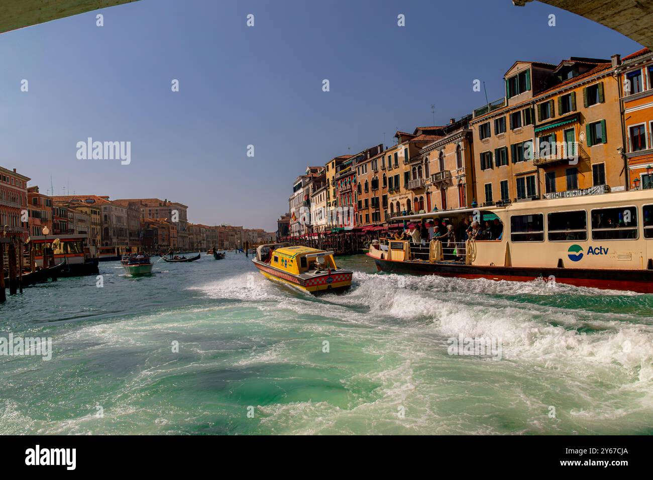 An emergency water ambulance speeds past a Vaporetto on the Grand canal ...