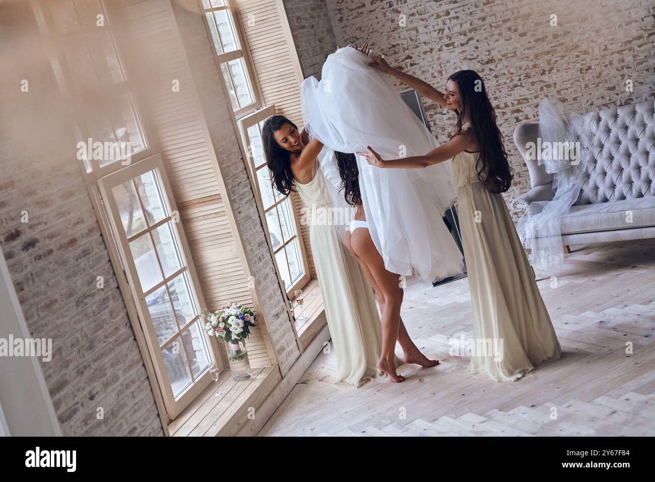 Happy moment. Full length top view of two attractive young women ...