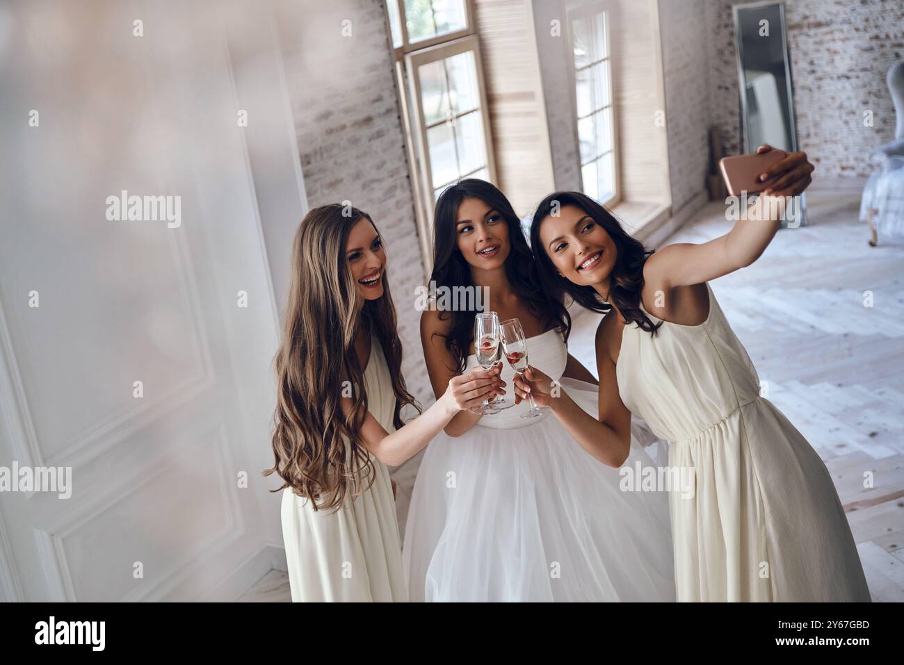 Capturing happy moments. Top view of attractive young bride bonding ...