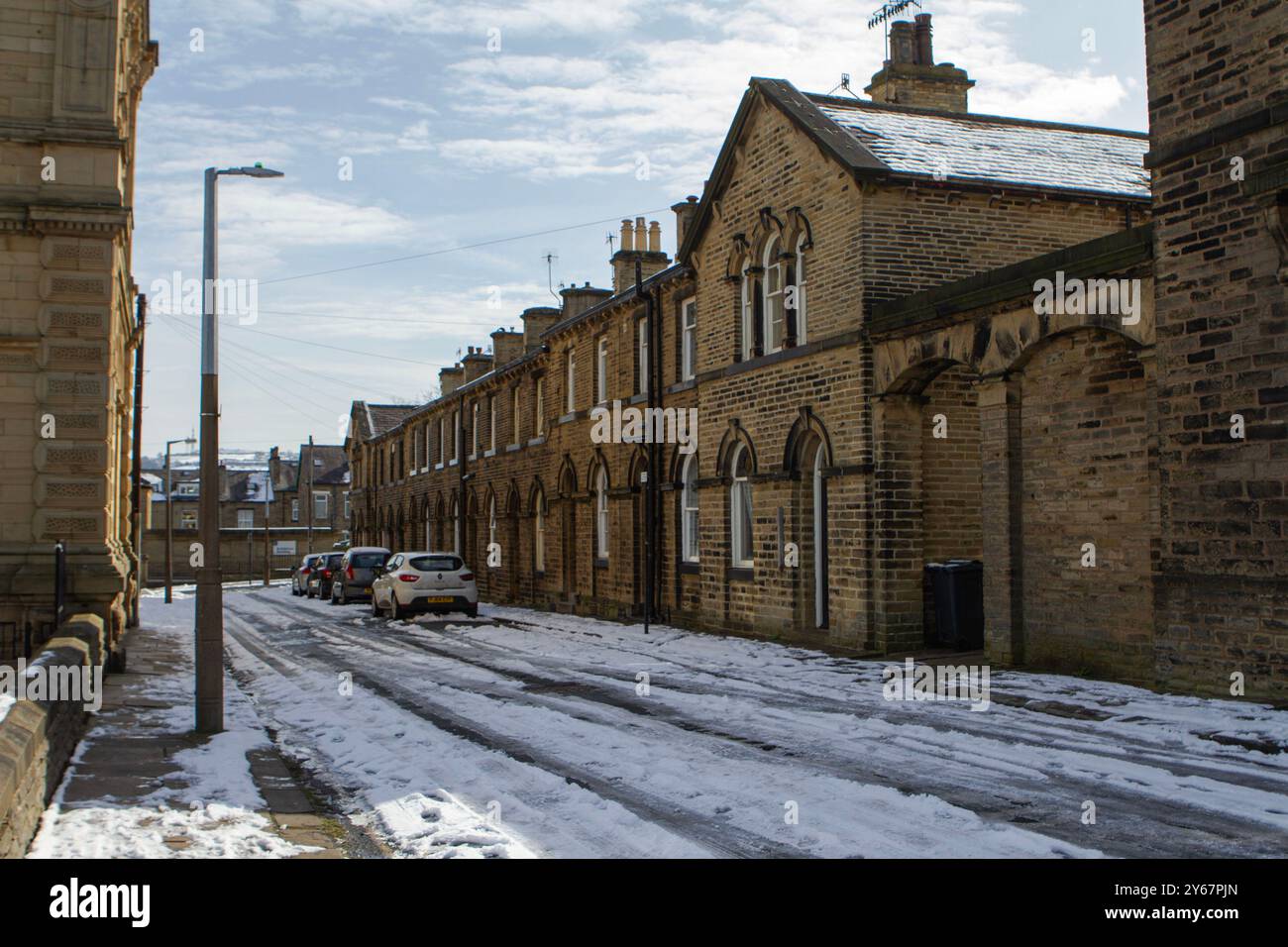 Basking in the glow of the winter sun, this historic street in Saltaire ...