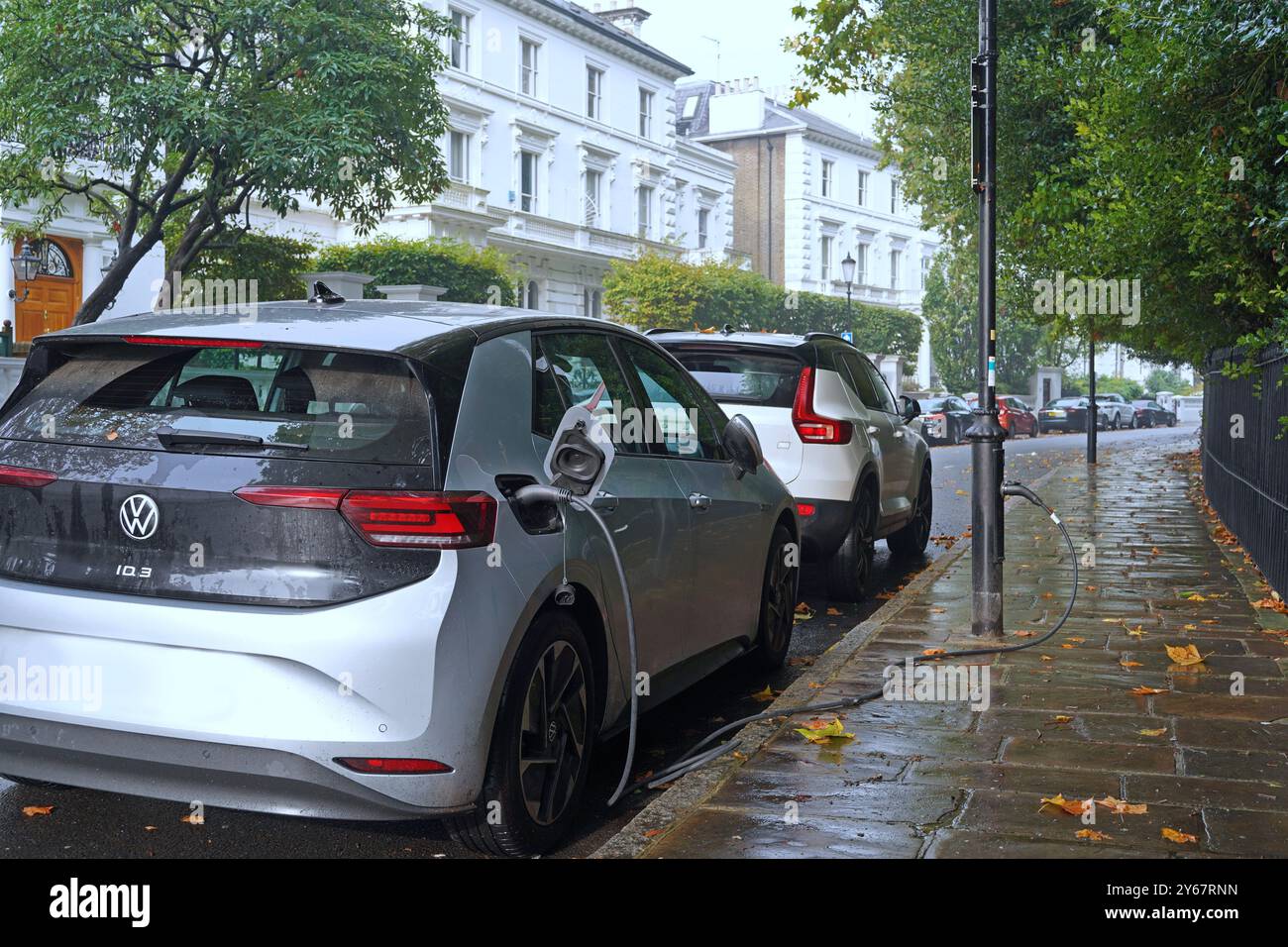 Electric car charge point from a public lamp post on the street in the ...
