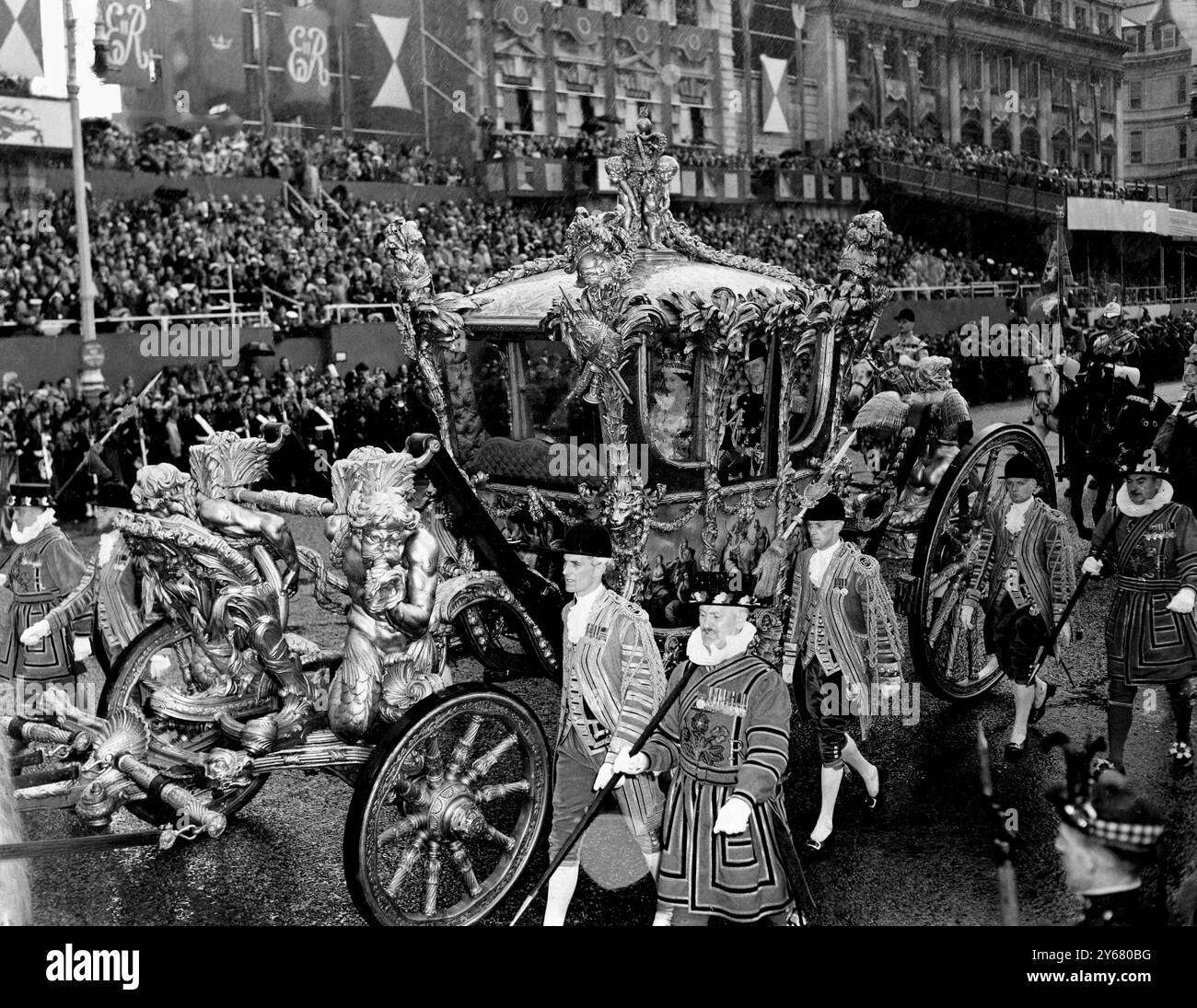 Queen Elizabeth II wearing the Imperial State Crown, and Prince Philip ...