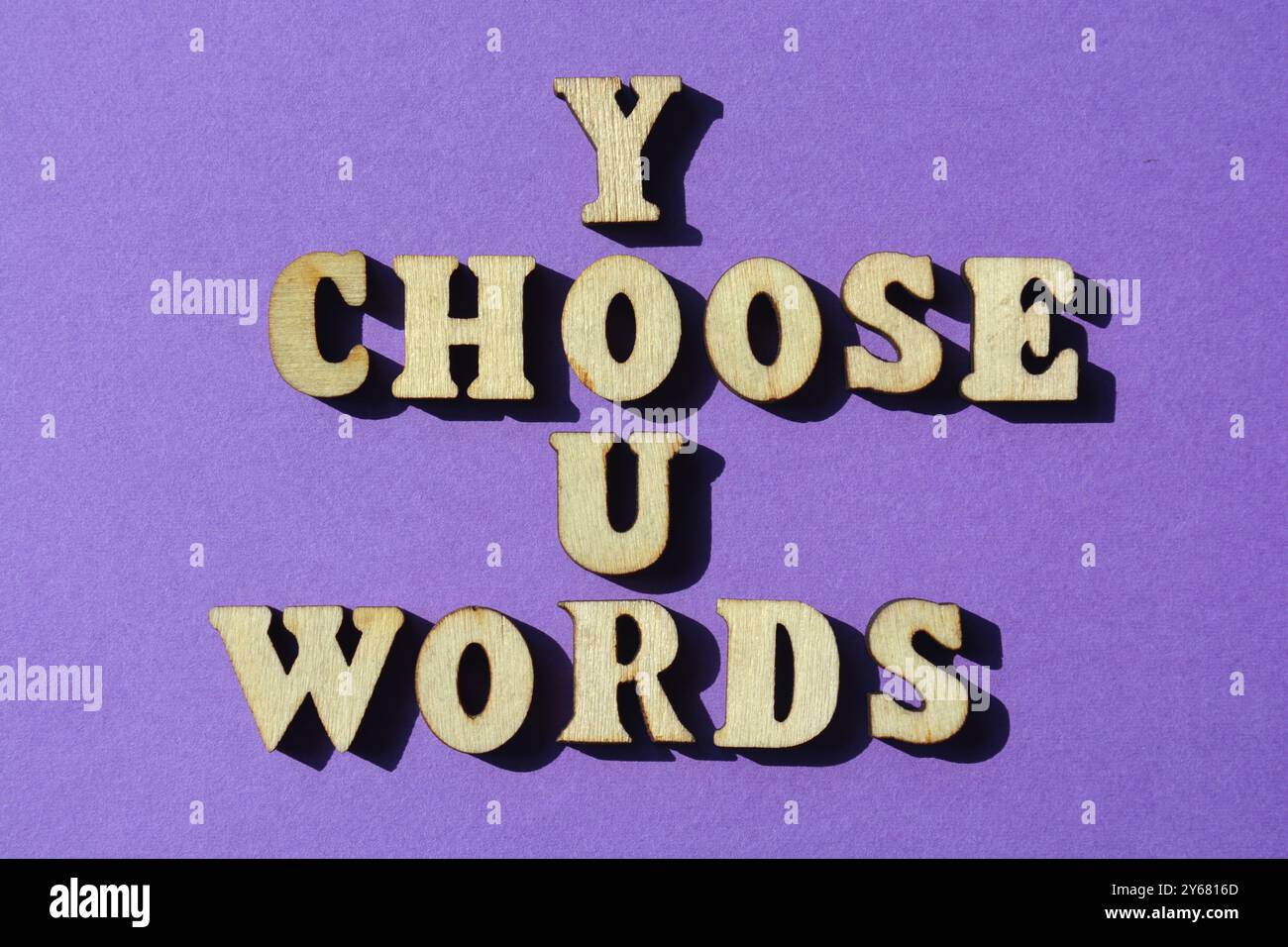 Choose Your Words, phrase in wooden alphabet letters isolated on purple ...