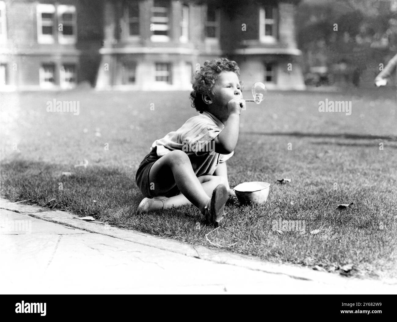 Master Mark Toy son of Sidney blowing bubbles Stock Photo - Alamy