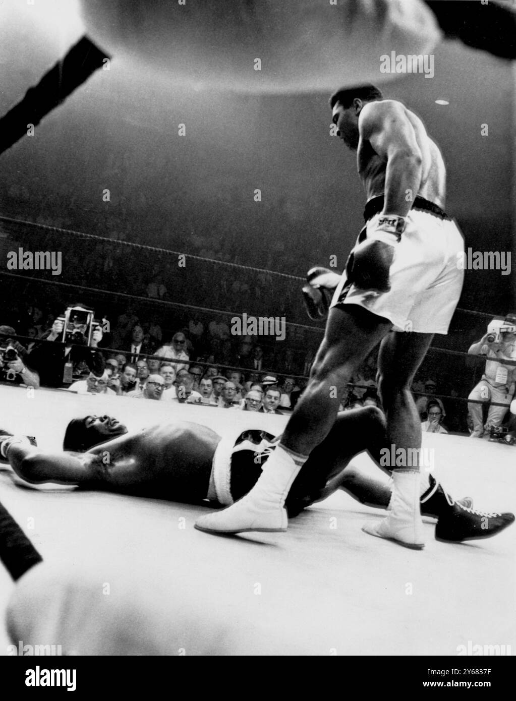World Heavyweight champion, Muhammad Ali towers over a fallen Sonny ...