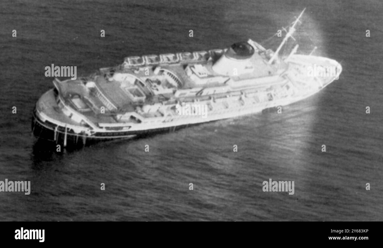 The sinking Italian luxury liner "Andrea Doria" as the ship lies ...