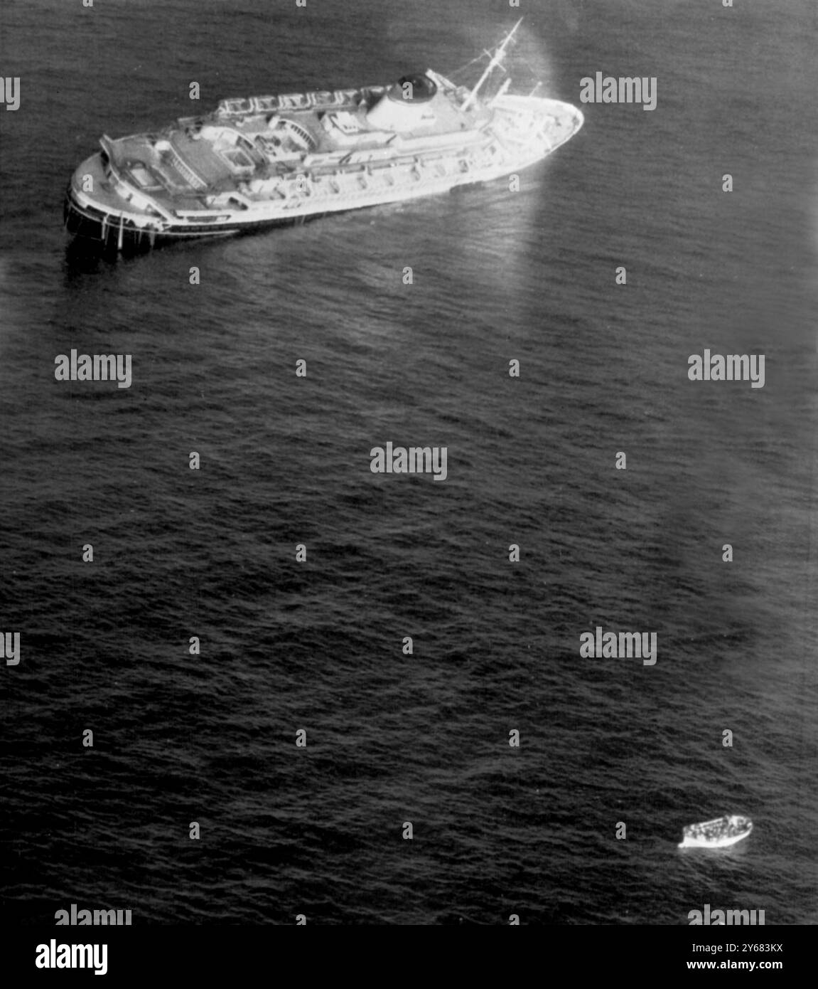 Survivors in lifeboat leave the sinking Italian luxury liner "Andrea ...