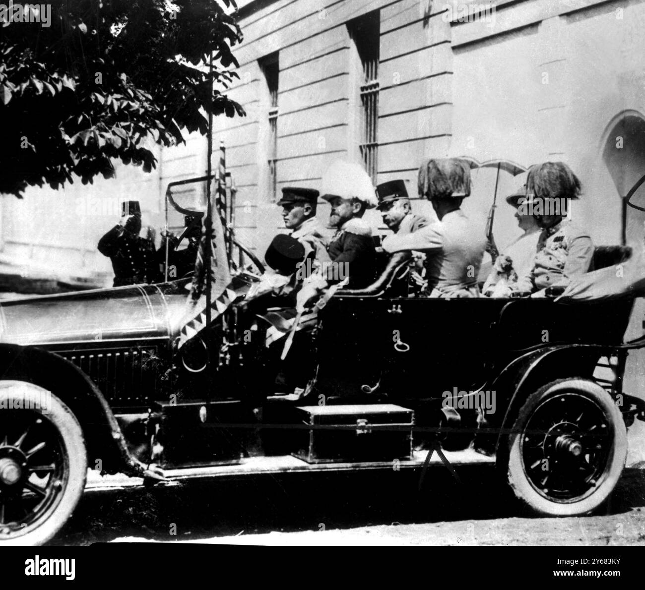 The Archduke and his wife with gorgeously uniformed officials in their ...