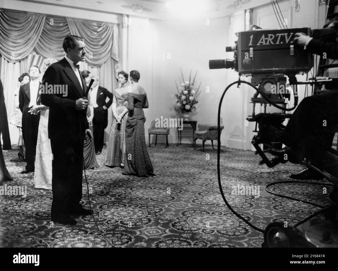 Leslie Mitchell before the television camera to introduce the artists ...