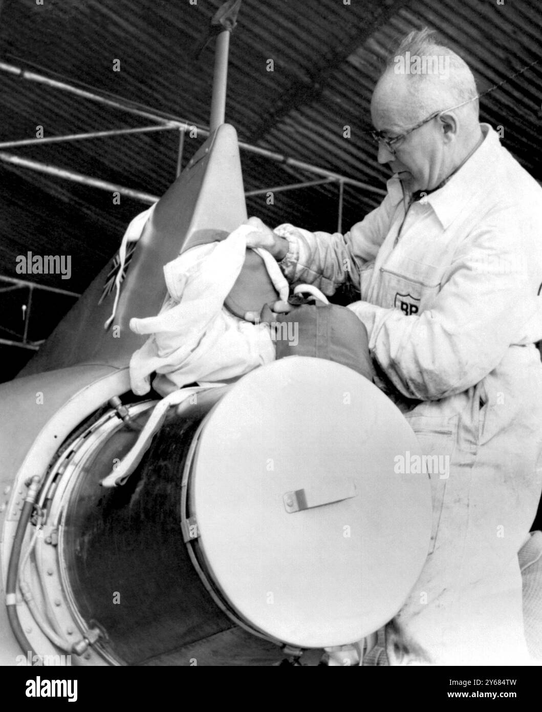Lake Coniston, Lancs: Mechanic Leo Villa checks over the new parachute ...