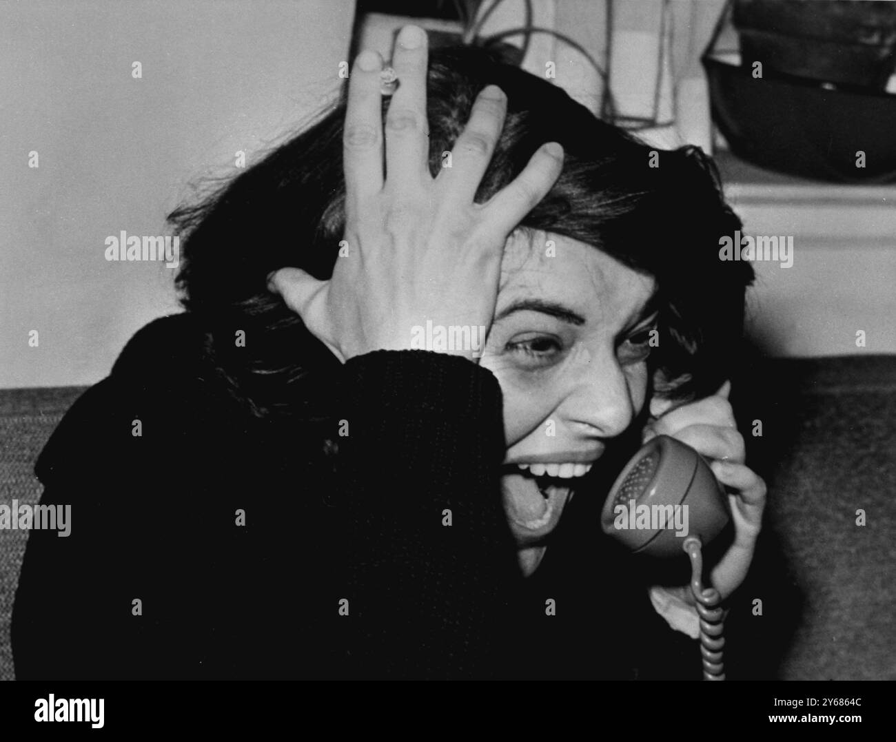 Santa Monica, California. Actress Anne Bancroft shouts down the phone ...