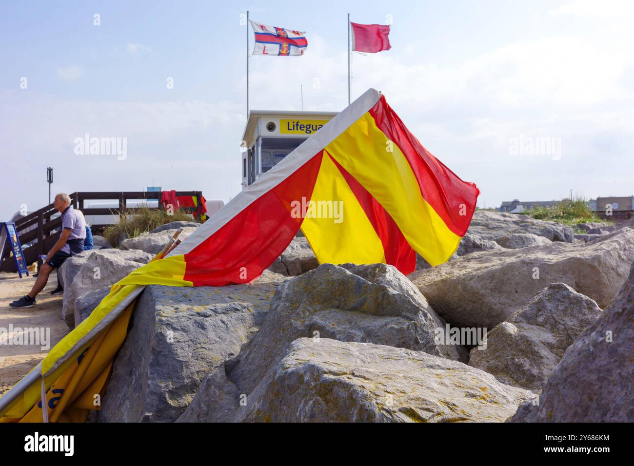 New Brighton, Wallasey, UK, September, 21, 2024: Bright warning flags ...
