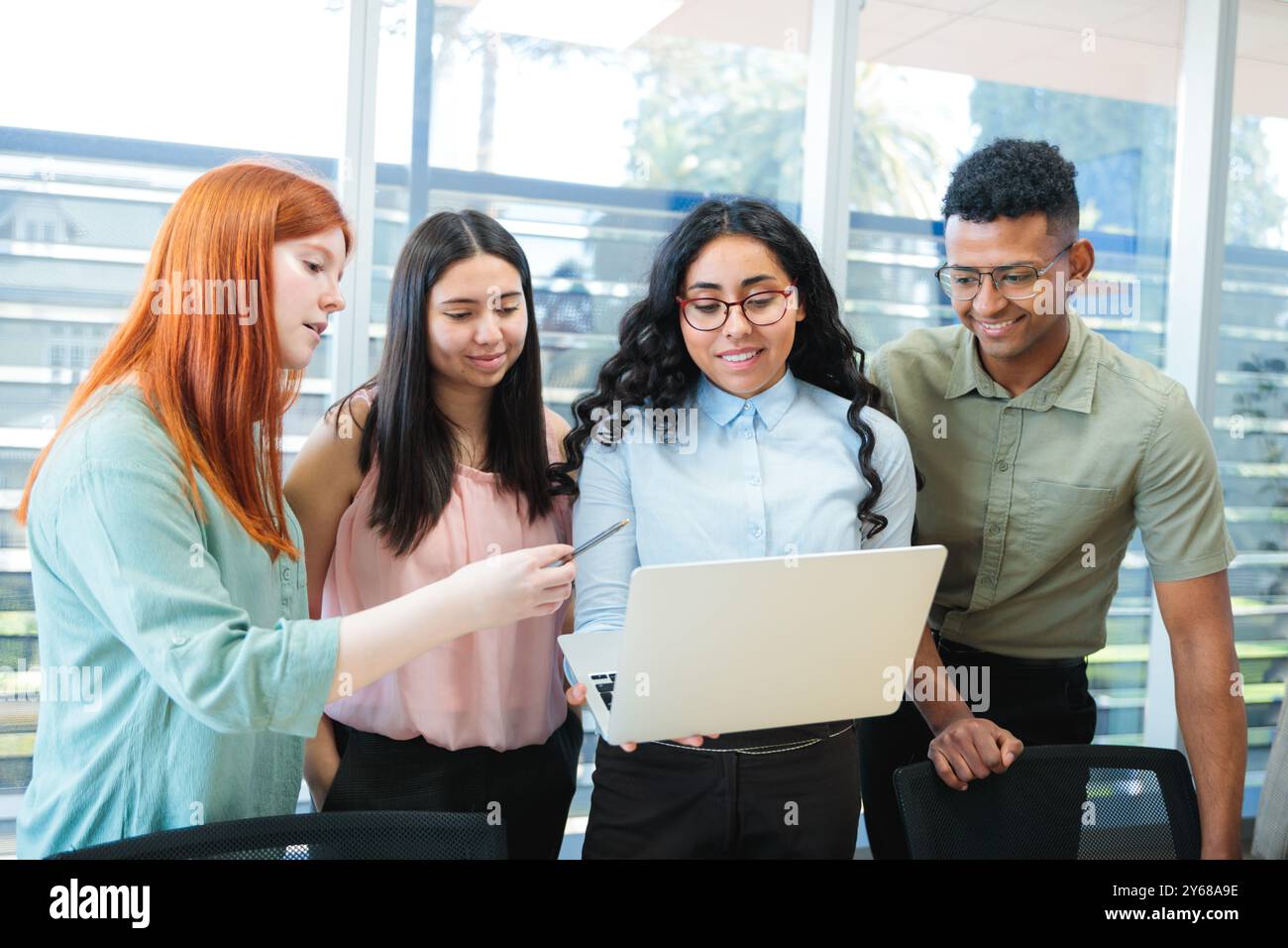 Multiracial teamwork collaborating on business strategies, standing ...