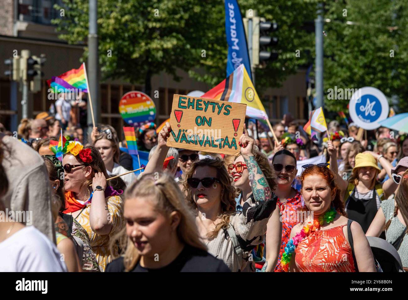 Protester with handwritten sign at Helsinki Pride 2024 parade on ...