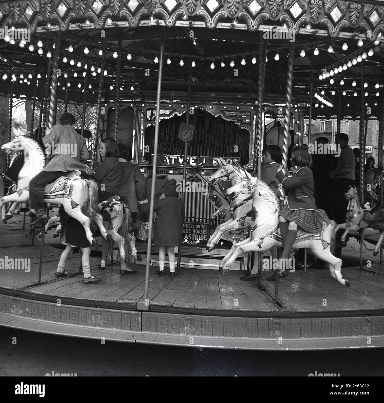 1950s, historical, funfair ride in town square, children riding a ...