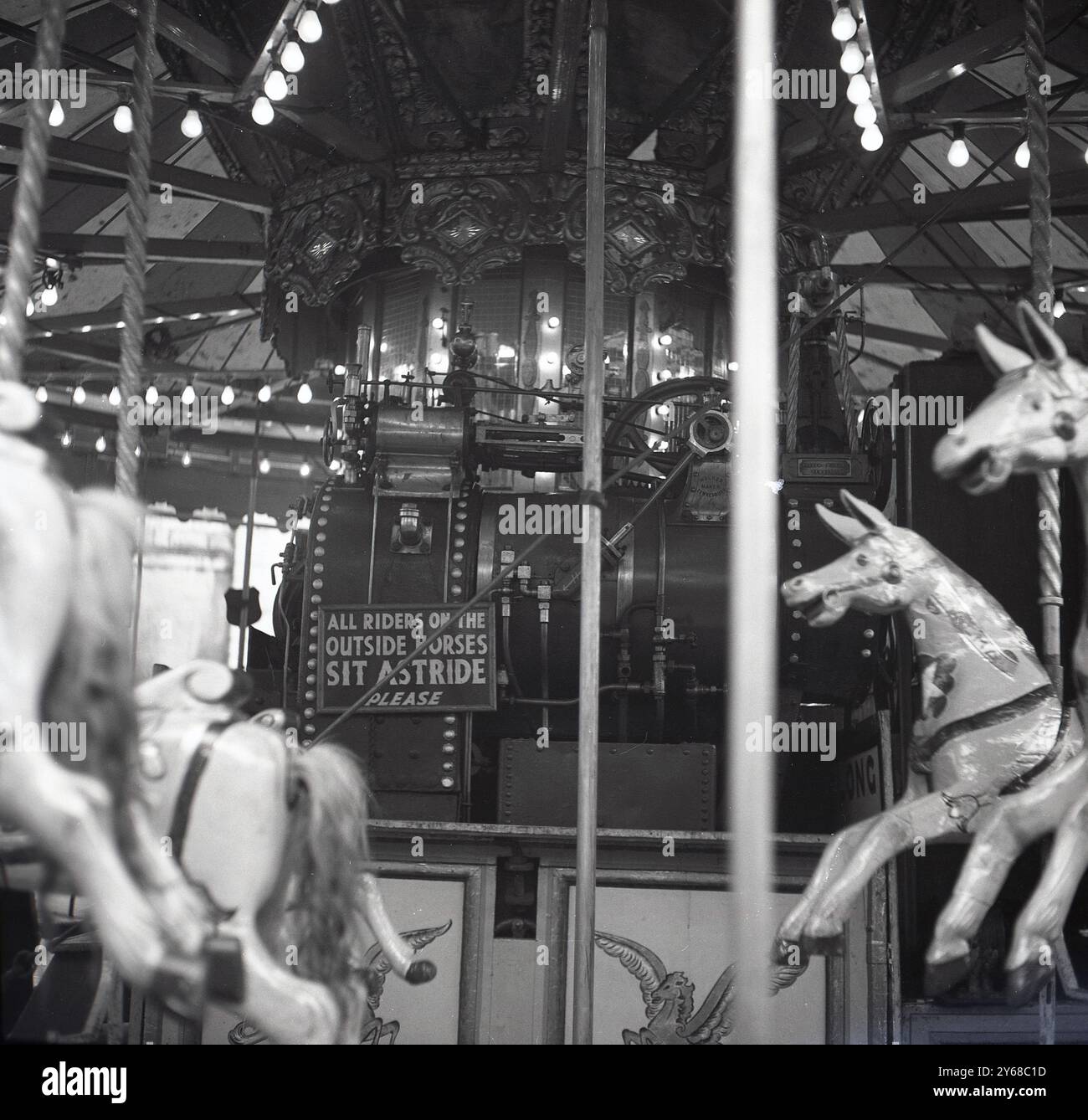 1950s, historical, funfair ride, sign on steam engine says all riders ...