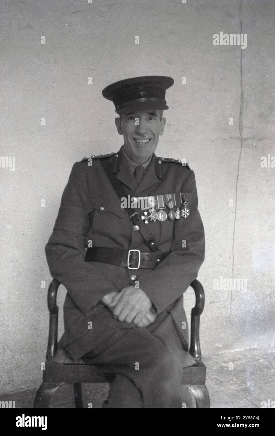 1960s, historical, sitting in a chair for a photograph, Colonel AES ...