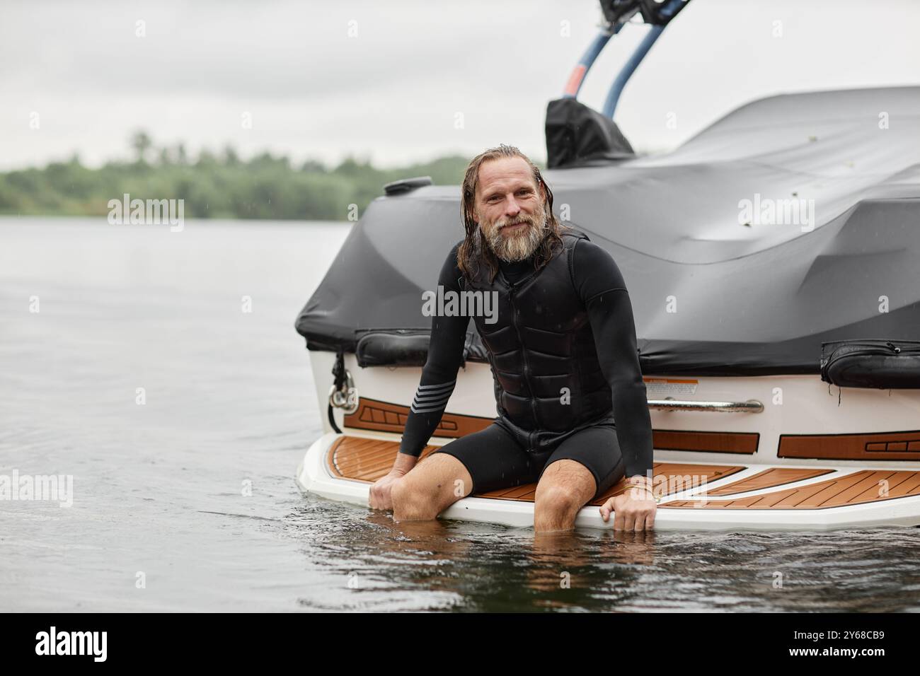 Man wearing wetsuit diving off hi-res stock photography and images - Alamy
