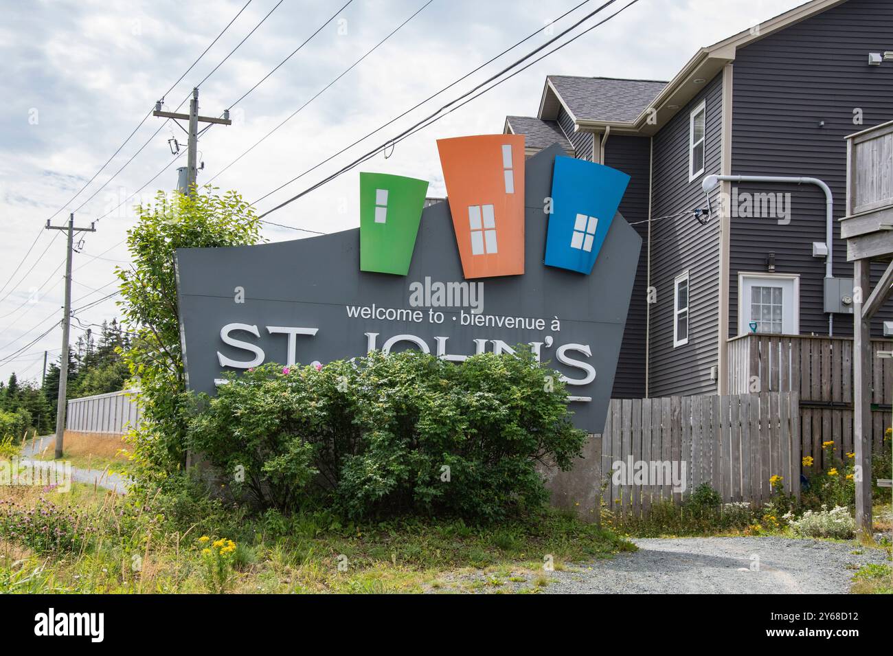 Welcome to St. John's sign covered with overgrown bush on Portugal Cove ...
