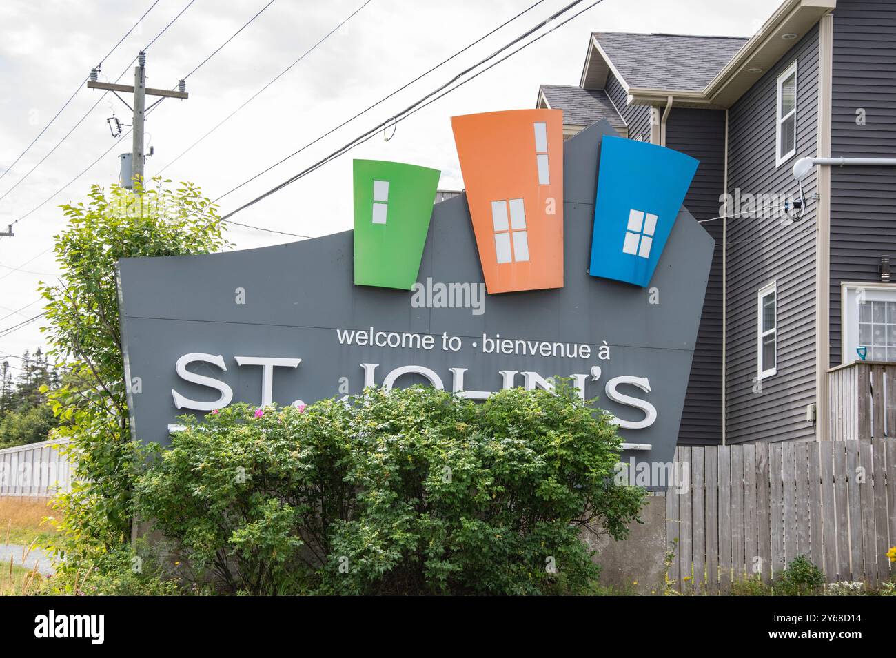 Welcome to St. John's sign covered with overgrown bush on Portugal Cove ...